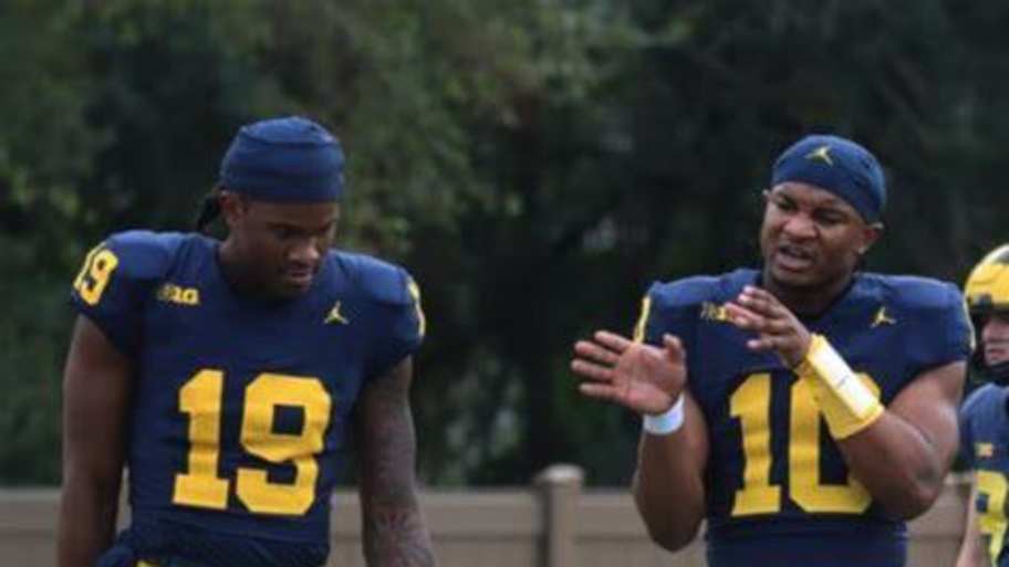 Coach Moore proclaims Michigan QB battle open to be earned