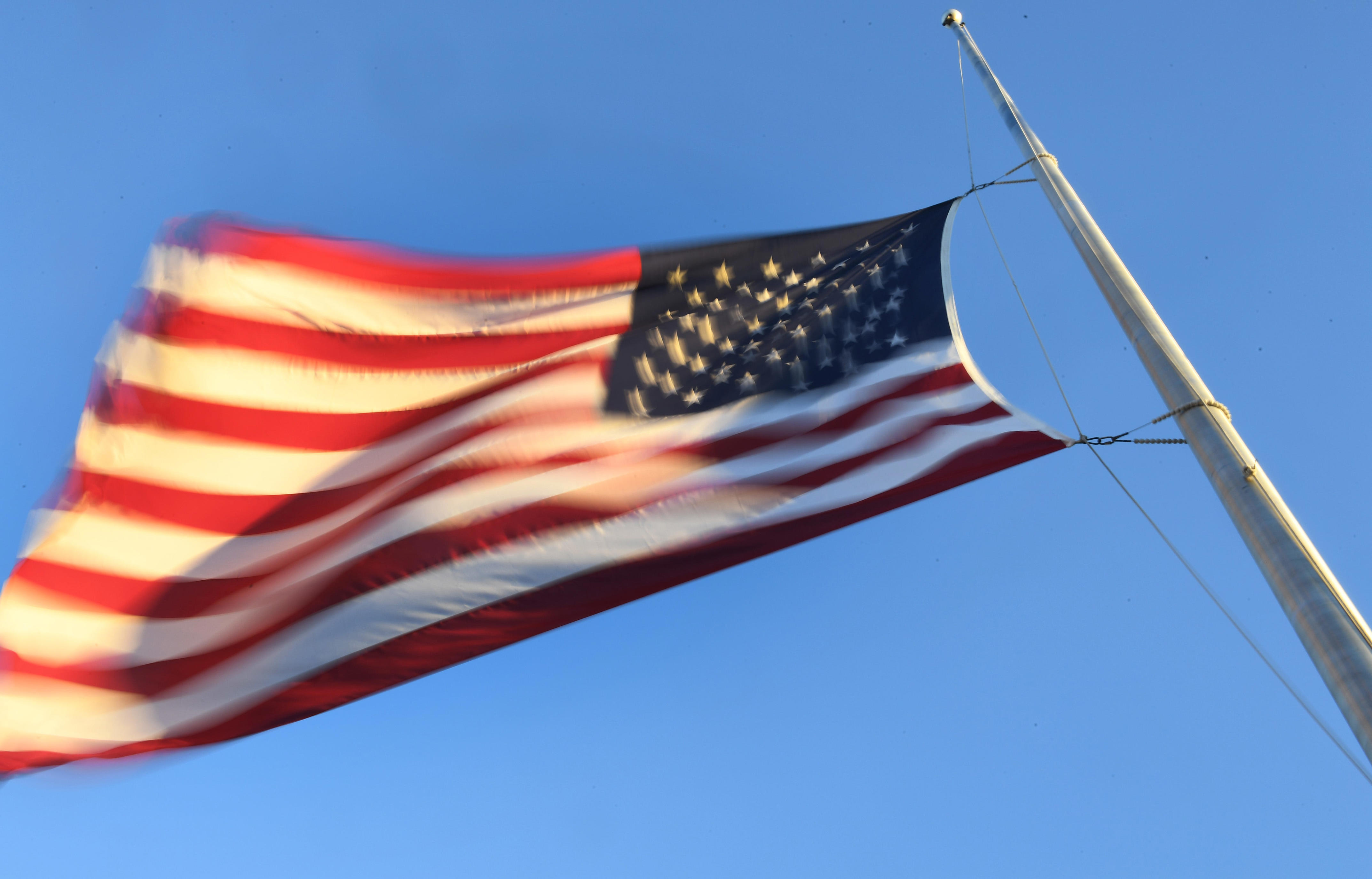 Why are flags flying at half-staff in South Carolina?
