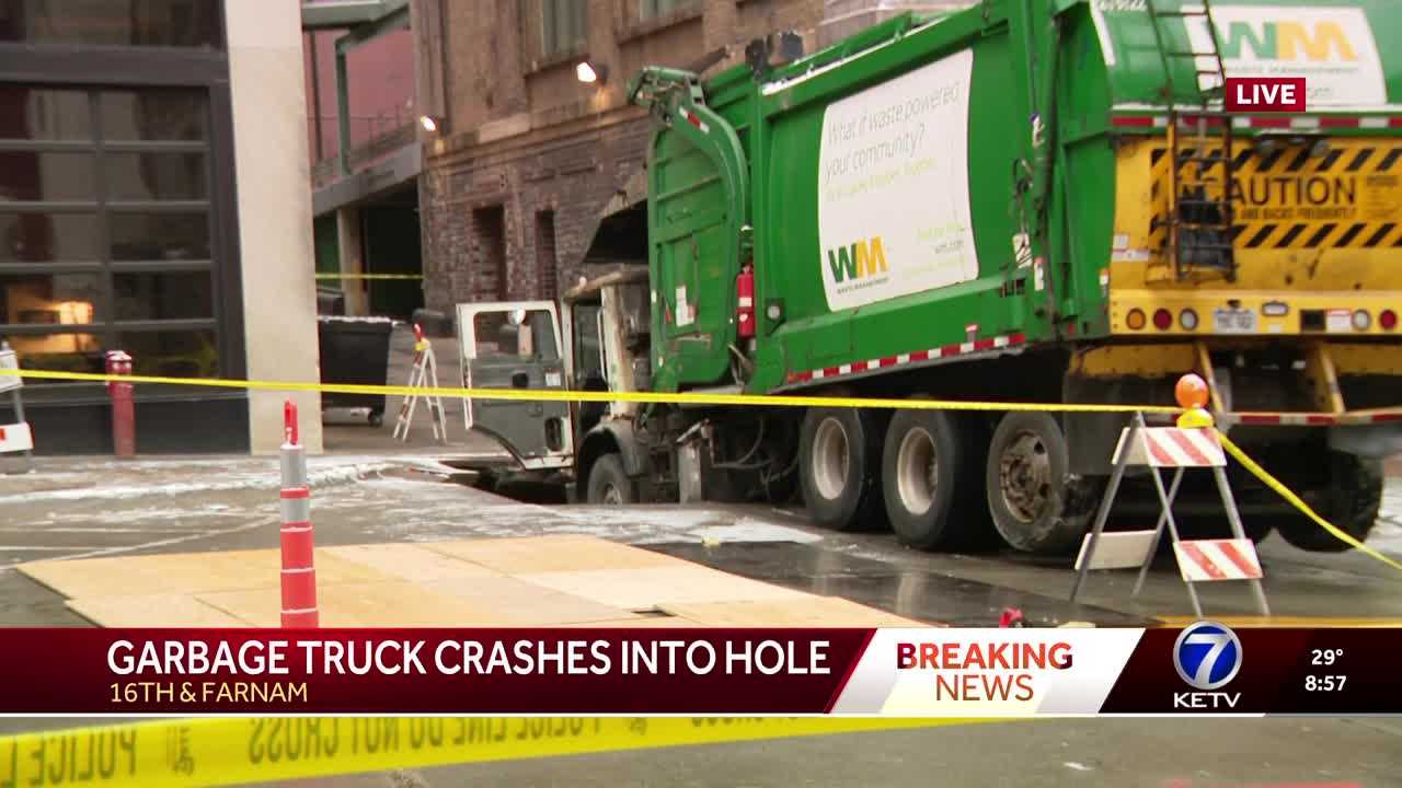 Video: Garbage truck crashes into sinkhole in downtown Omaha