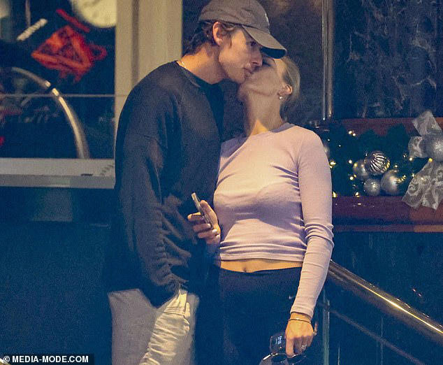 Sealed with a kiss! Tennis power couple Alex de Minaur and Katie Boulter enjoy a night out ...