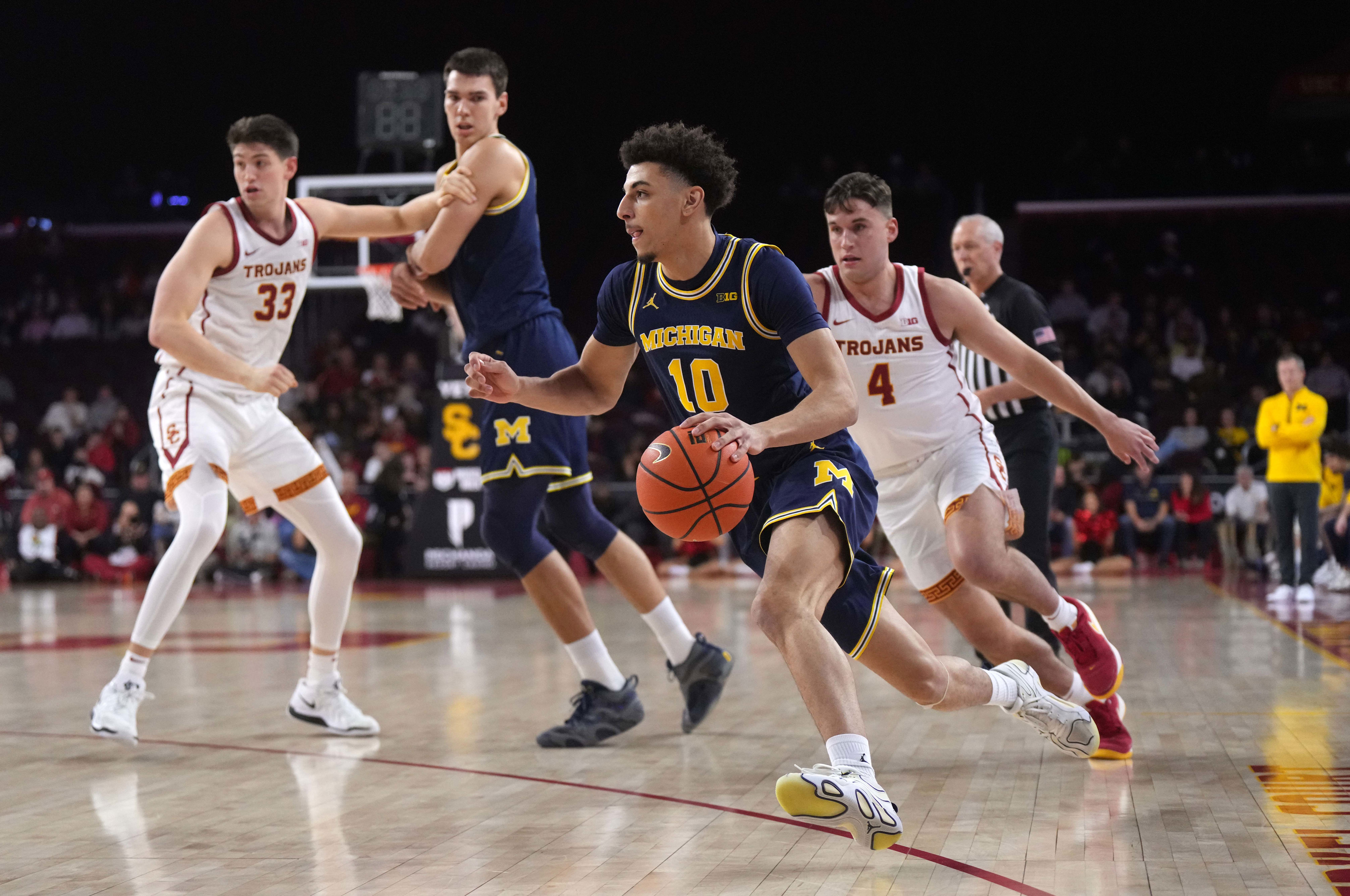 Michigan jumps back into college basketball rankings in midst of Los ...