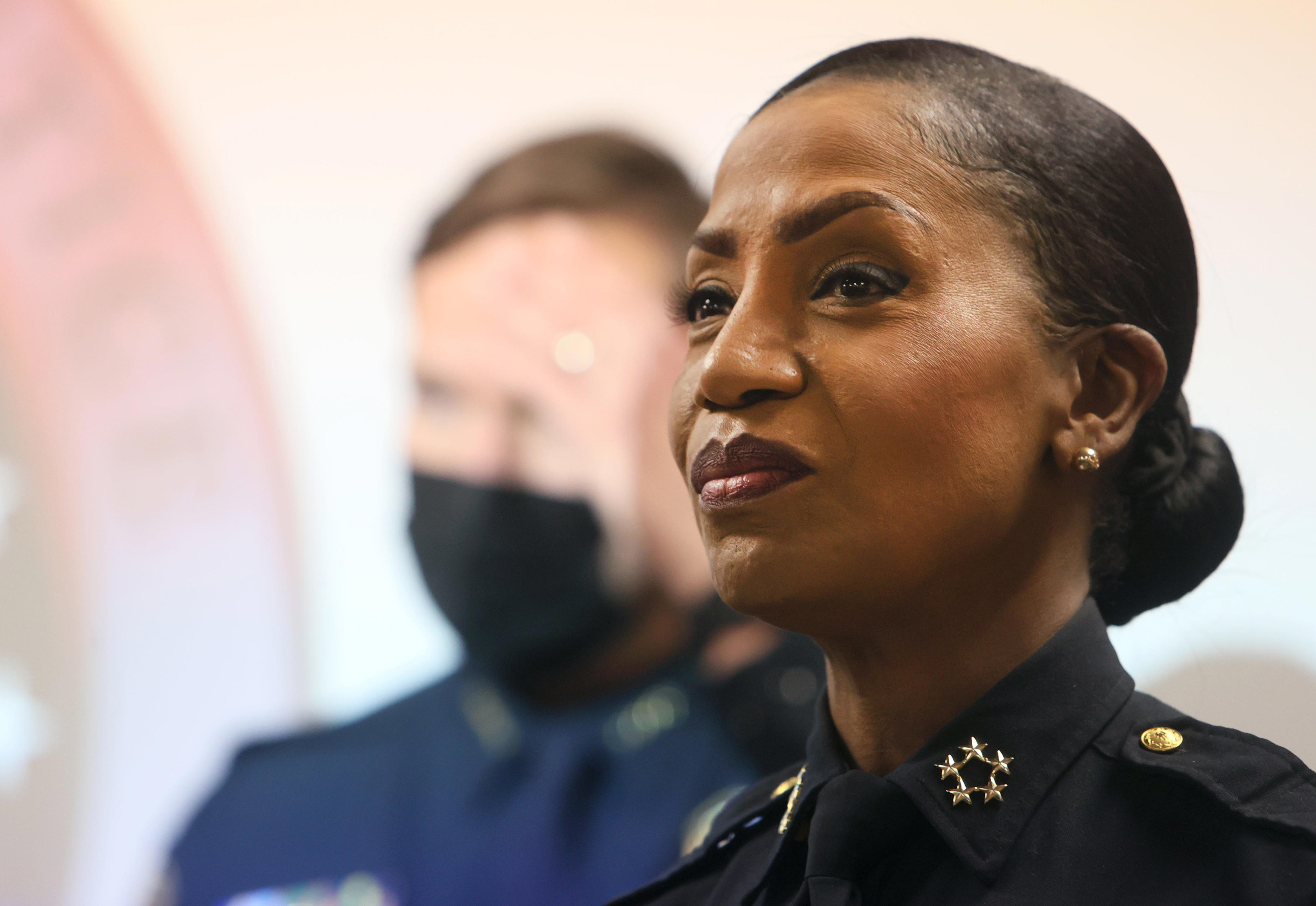 Woman charged after body found in police impound, murders below 2020 ...
