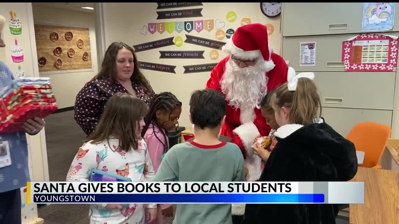 Santa spreads Christmas cheer with books at Potential Development
