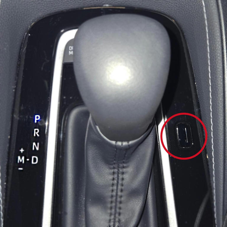 What is the little slot next to the gear shift in my car?