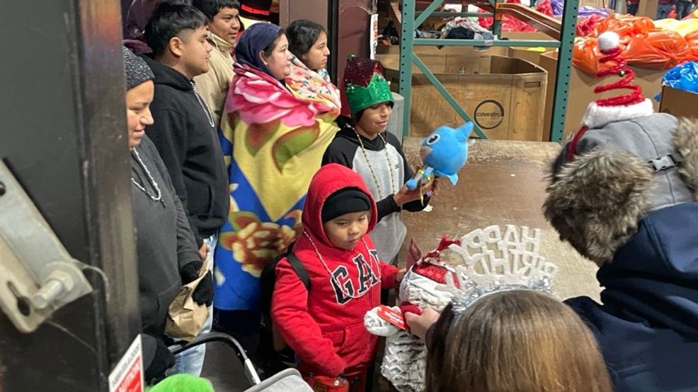 Children receive presents on Christmas Eve from the FOX26 Les Schwab ...