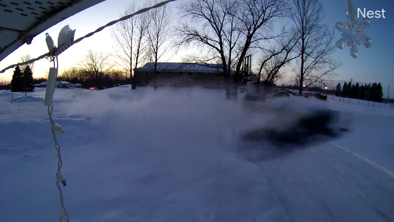 Snowmobile Crashes Into Garage Moments After Owners Leave