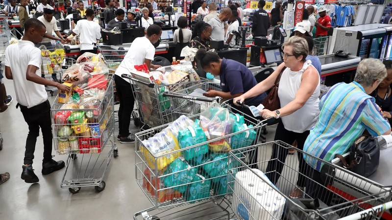 Shoppers keep spending despite mounting pressure as retail sales rise ...