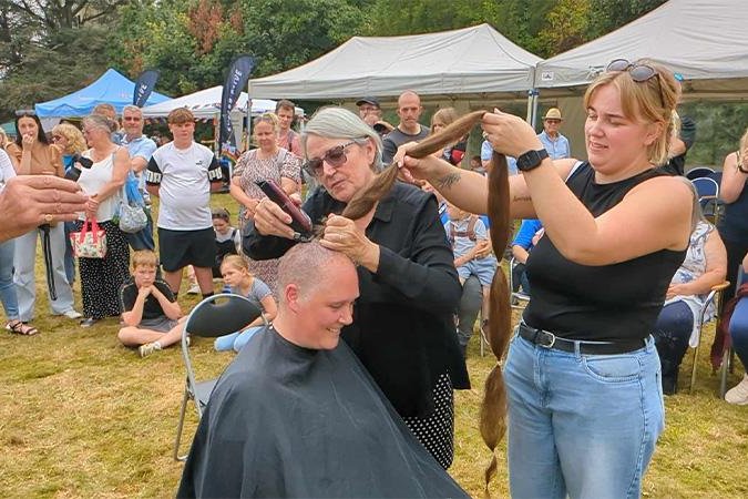 Watch: Two Britons cut their long locks to break records for hair donation