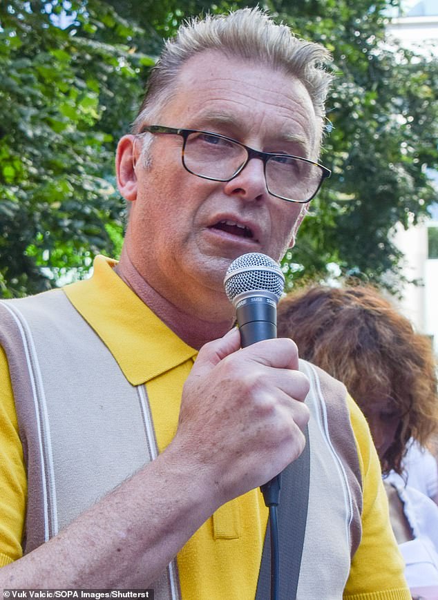 Moment angry shoppers try to barge Animal Rising activists out of way