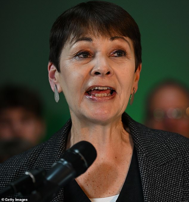 Moment angry shoppers try to barge Animal Rising activists out of way