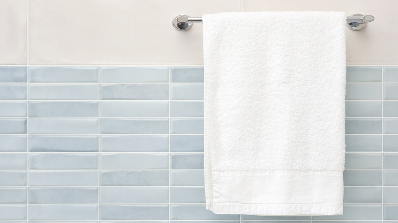 The Rubber Band Trick That Will Keep Your Towel Racks Secure And Stable
