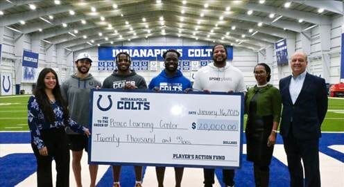 Colts players award donation to Peace Learning Center