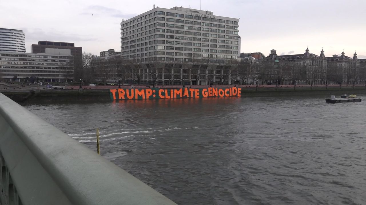 A huge anti-Trump banner unfurled in front of the British Parliament in ...