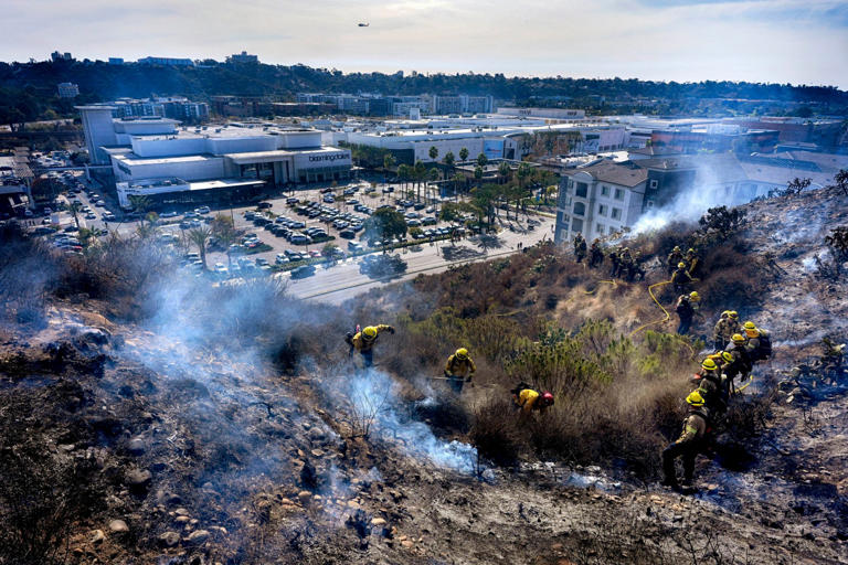 Fire near shopping mall in California threatens homes and forces ...