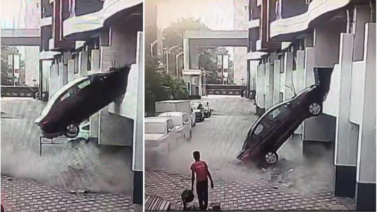 Car crashes through wall, falls from first floor parking of Pune apartment. Video