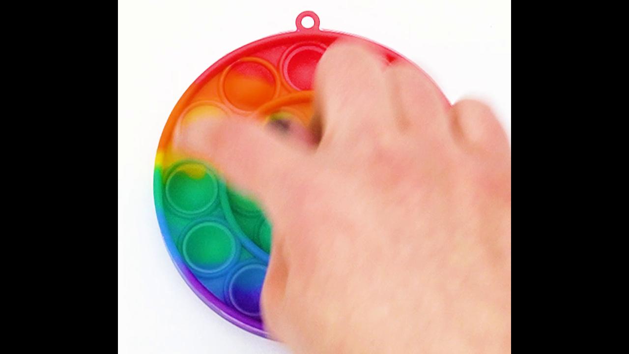Satisfying Poking A Circular Multi-Colored Pop It In Clockwise Motion