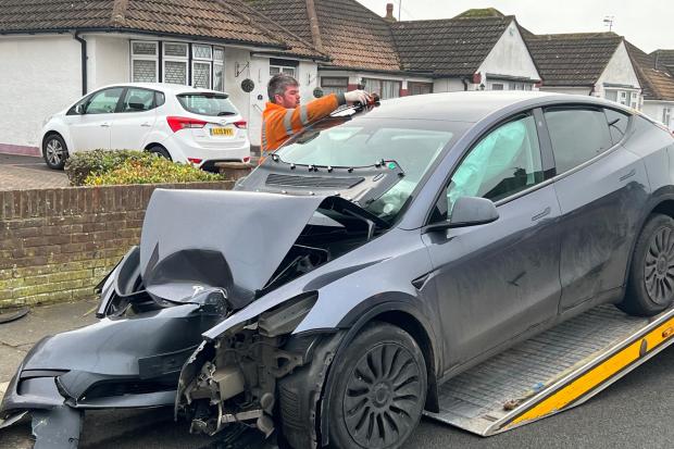 Tesla badly damaged after crashing into telegraph pole