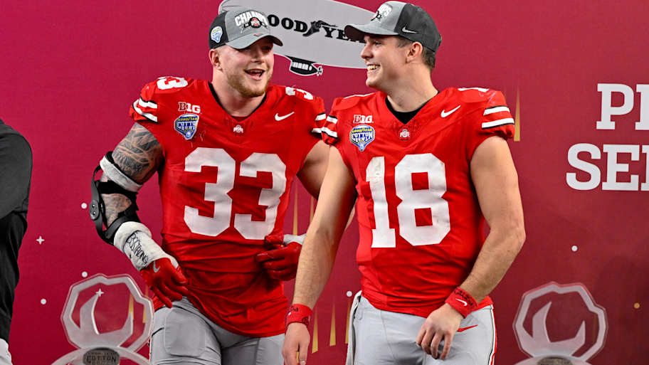 Ohio State National Champion Duo Serves Fans at Columbus Raising Cane’s