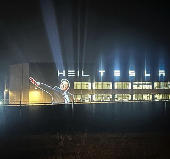 'Heil Tesla': Elon Musk doing 'Nazi salute' projected onto German Tesla ...