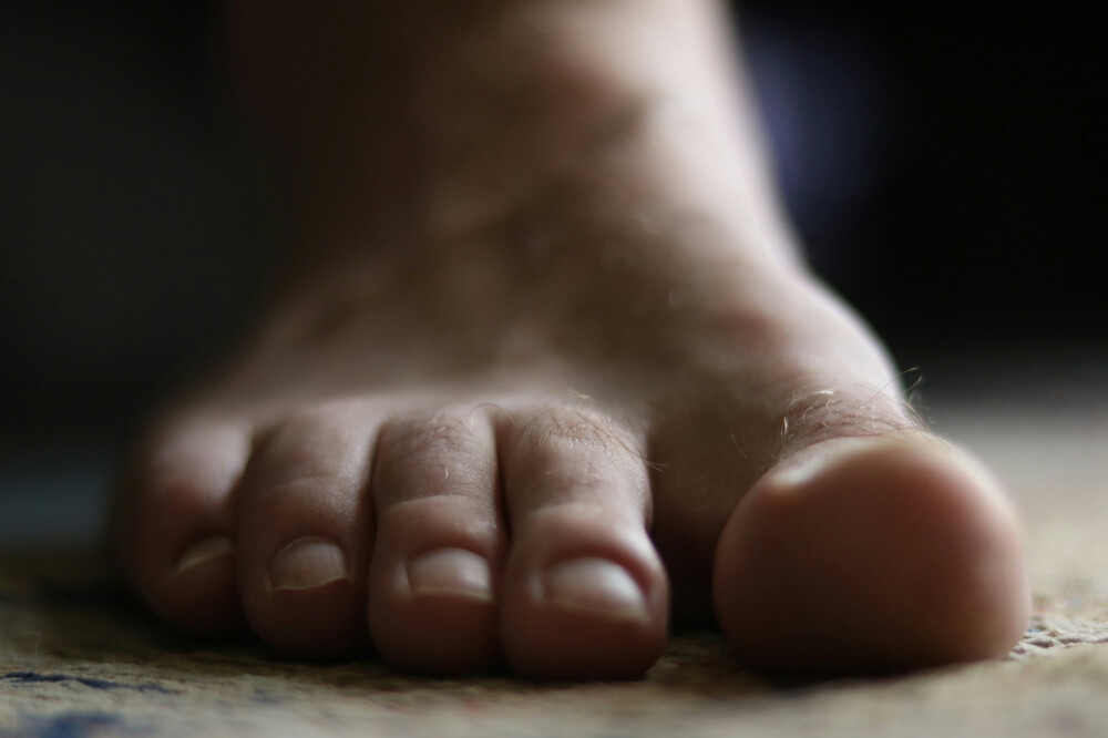 School cook mashes potatoes with his feet