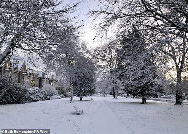 Cars skid in rush hour blizzards as Met Office issue weather warnings