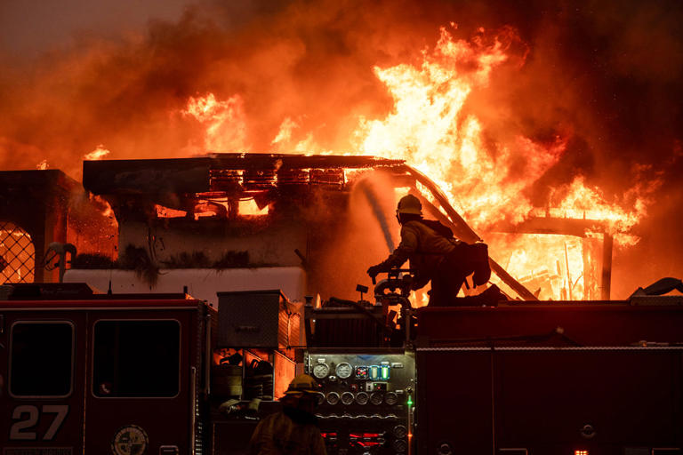 Los Angeles wildfires kill five and trigger exodus as firefighters ...