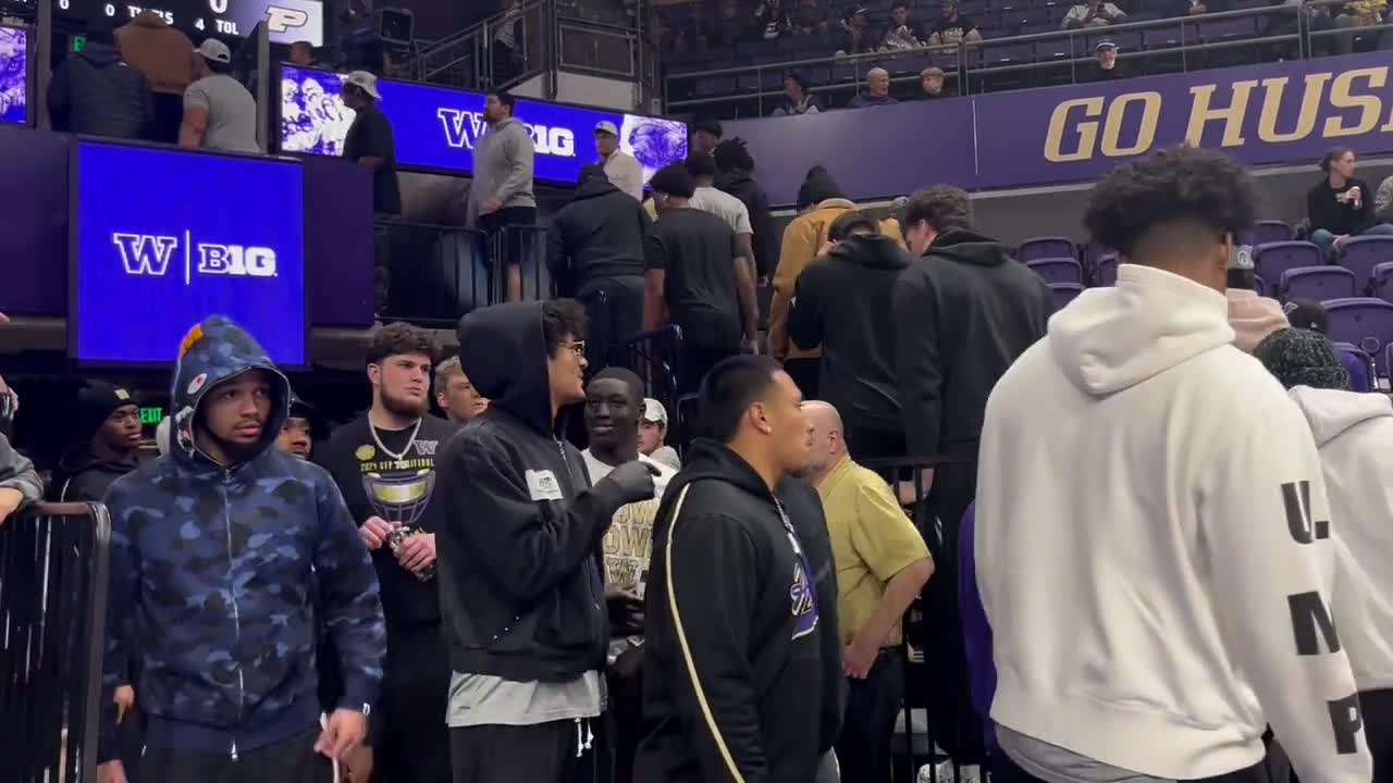 UW Huskies Football Team Walking Into Hec Ed