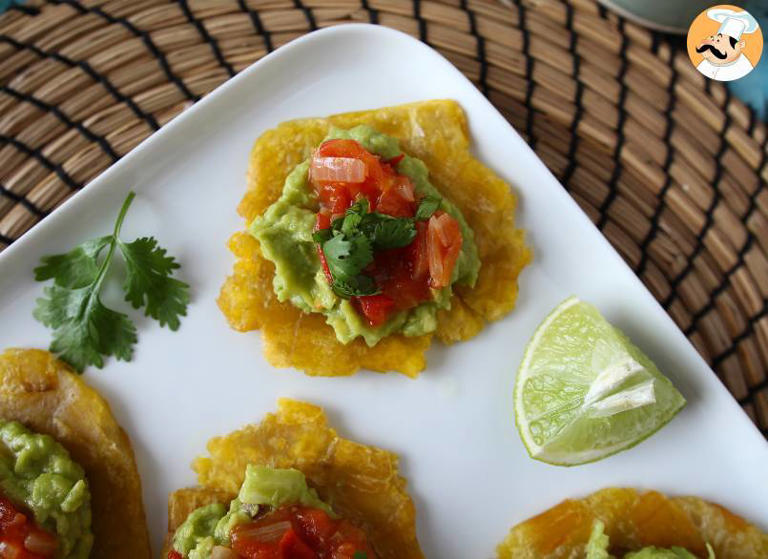 Patacones, Colombian plantain toast with guacamole and tomatoes