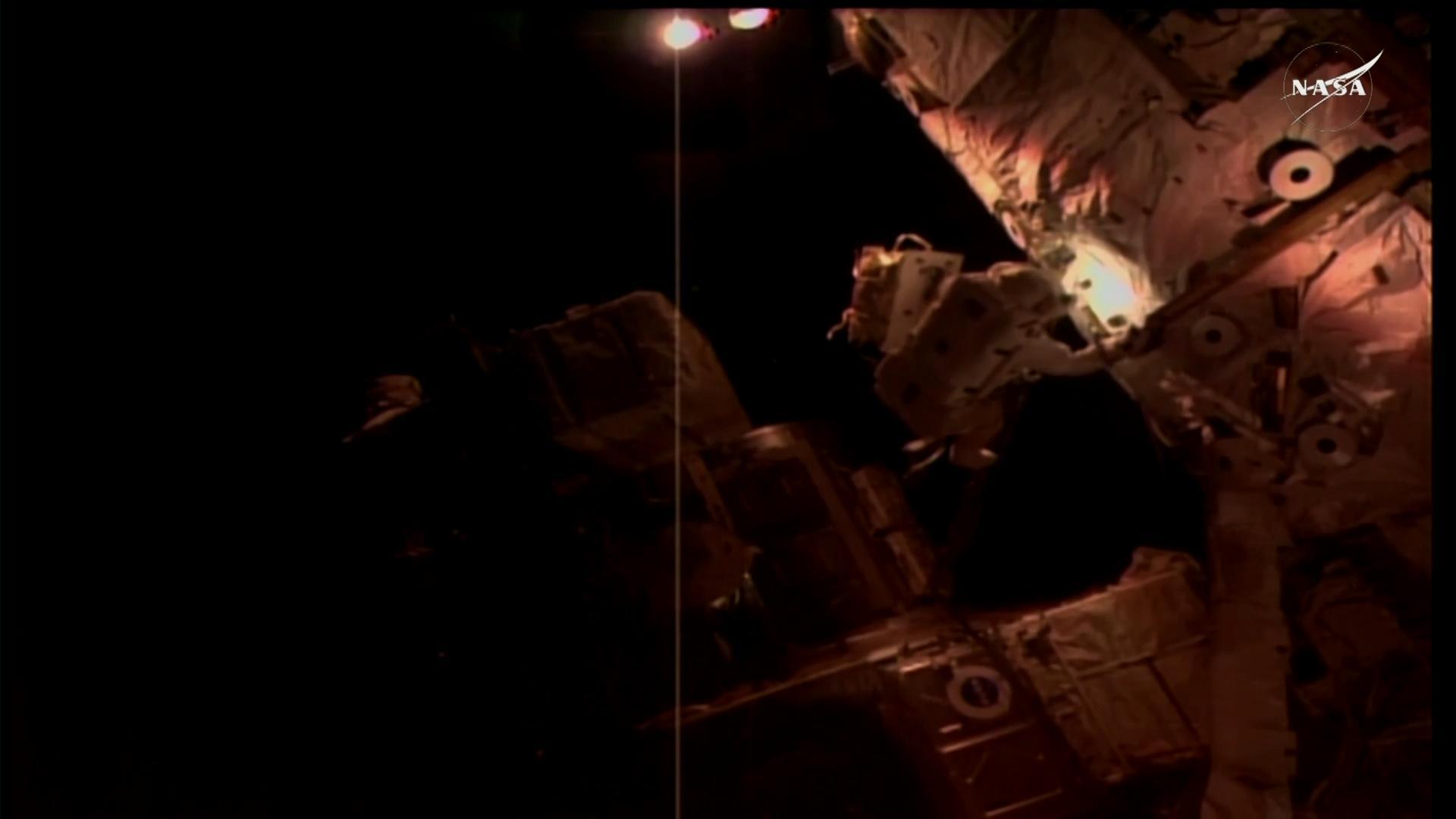 NASA's stuck astronaut steps out on a spacewalk after 7 months in orbit