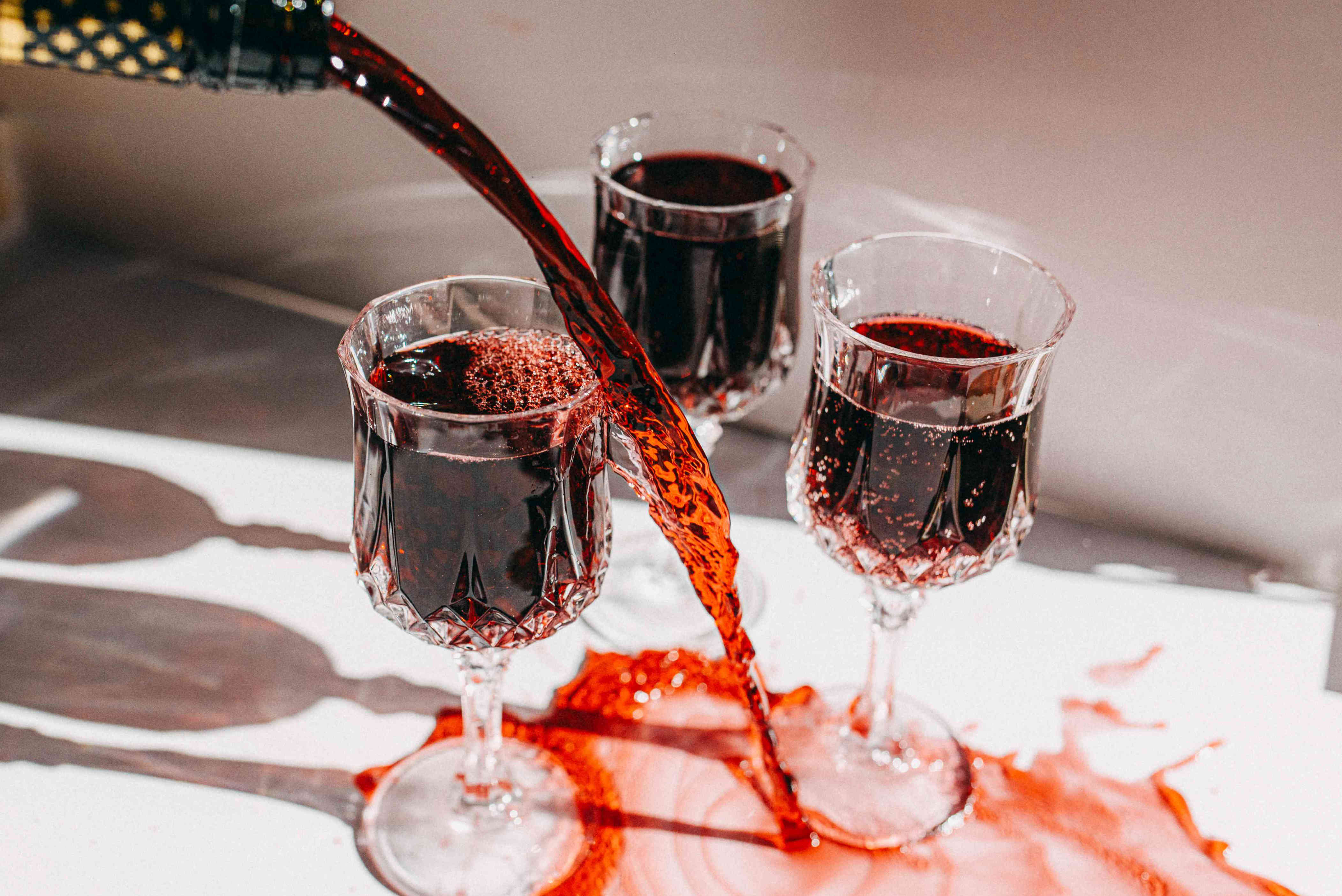 How to Get Red Wine Stains Out of Your Couch, According to Experts