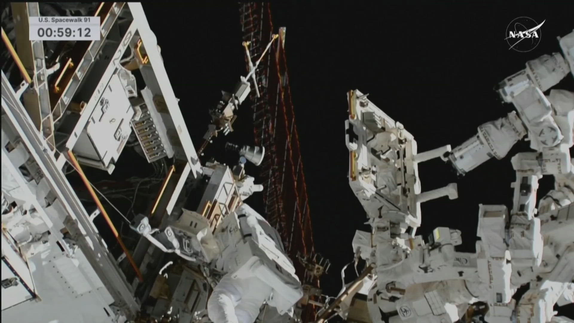 NASA astronauts conduct repairs during spacewalk on ISS