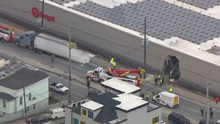 Dump truck crashes into NJ Target breaking open wall of store