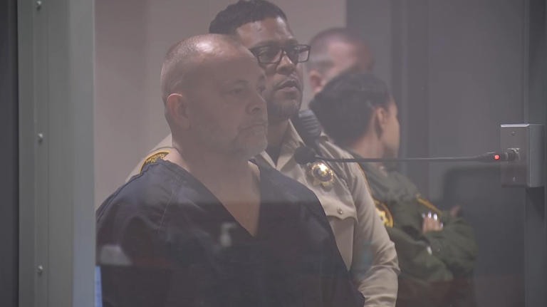 Las Vegas officer accused of pointing gun at ex-wife’s boyfriend