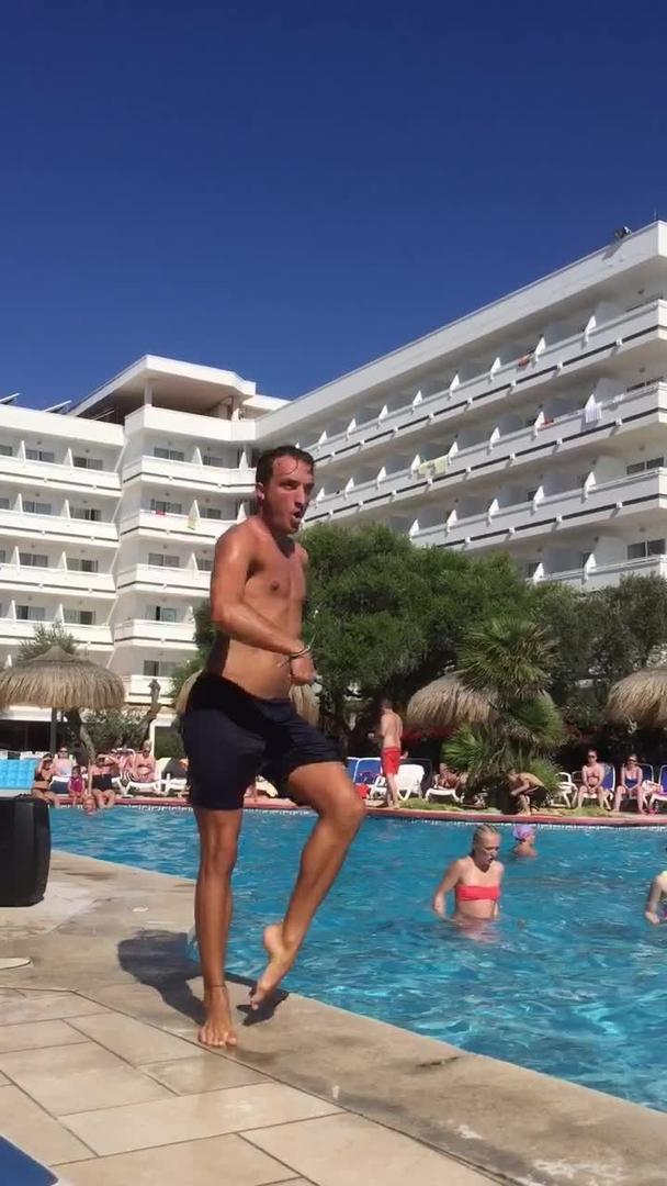 Energetic Instructor Teaches Water Aerobics Class