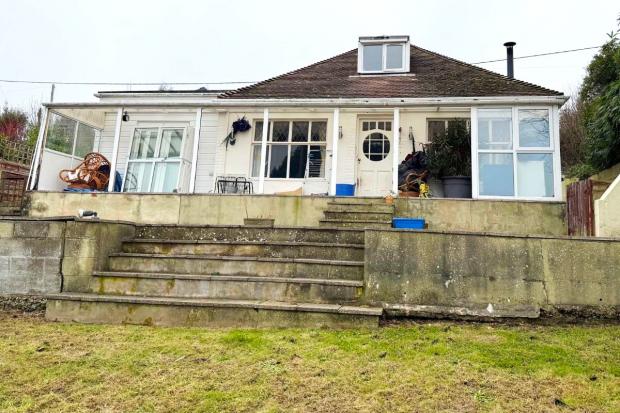 Property with 'noticeable structural movement' in coastal area sells at ...