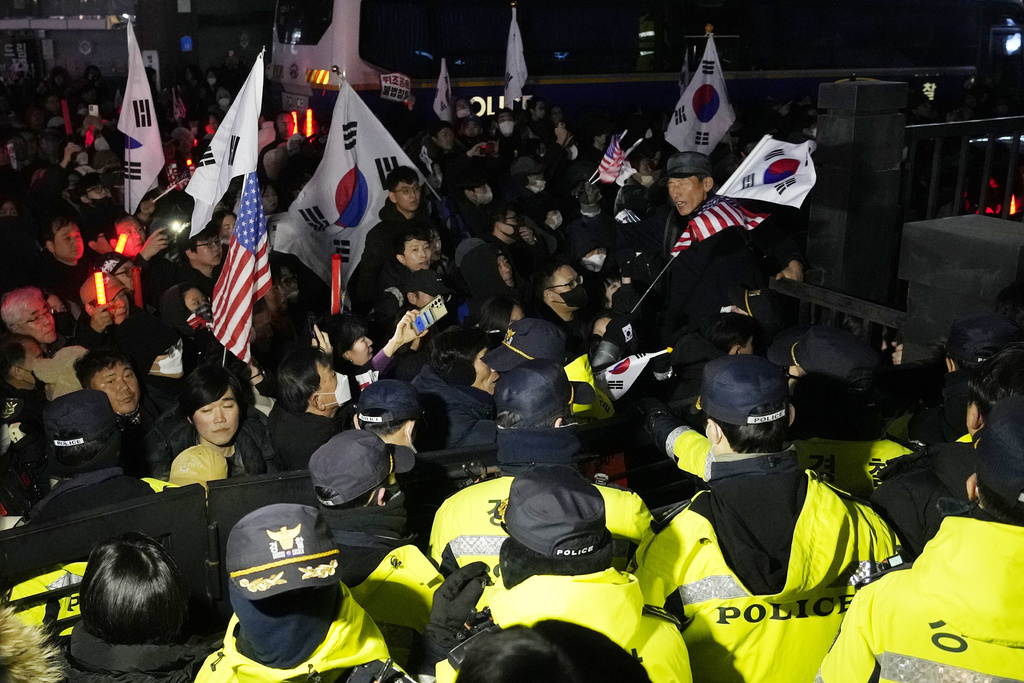 South Korea's impeached president is arrested over a martial law ...