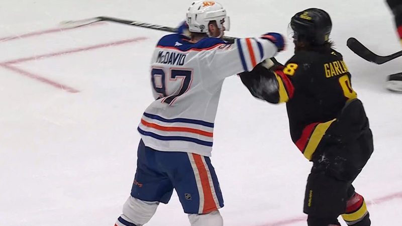 Connor McDavid delivers vicious crosscheck to the head of Conor Garland.