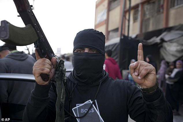 Hamas terrorists with AK-47s take to streets for ceasefire parade