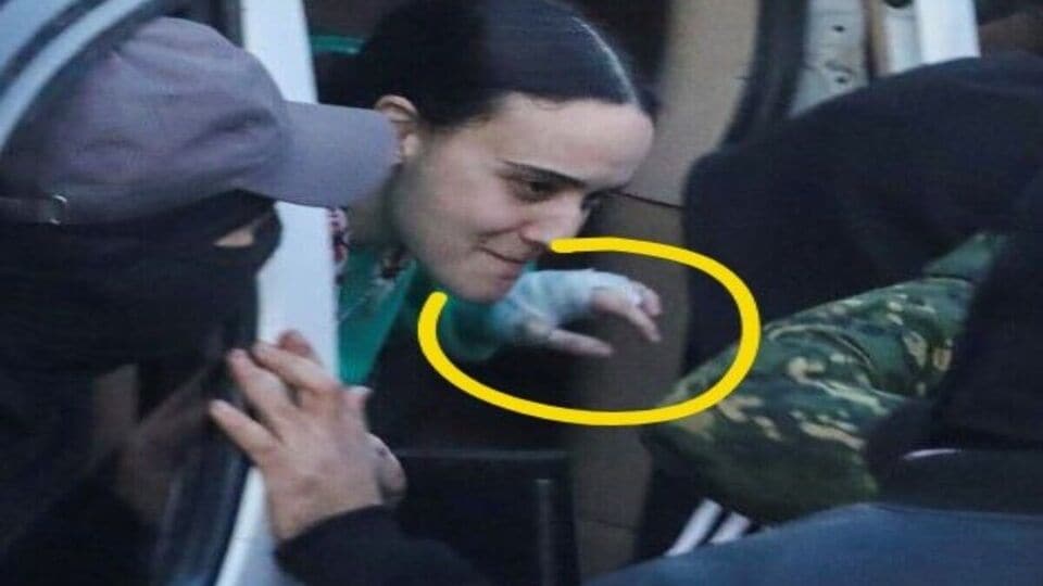 Emily Damari, freed Israeli hostage, shows hand with two fingers ...