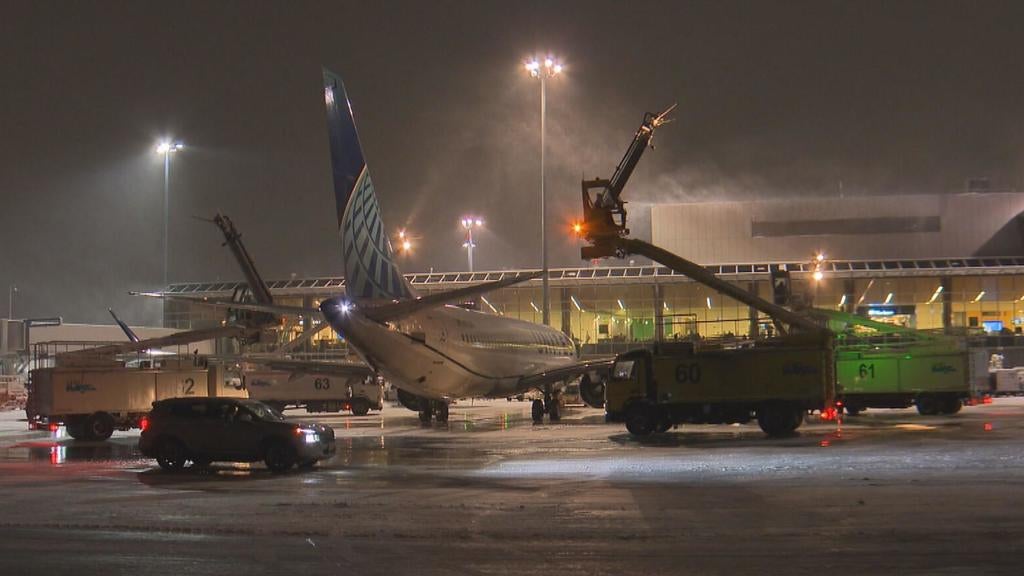 Here's how crews at Boston's Logan Airport clear snow from runways