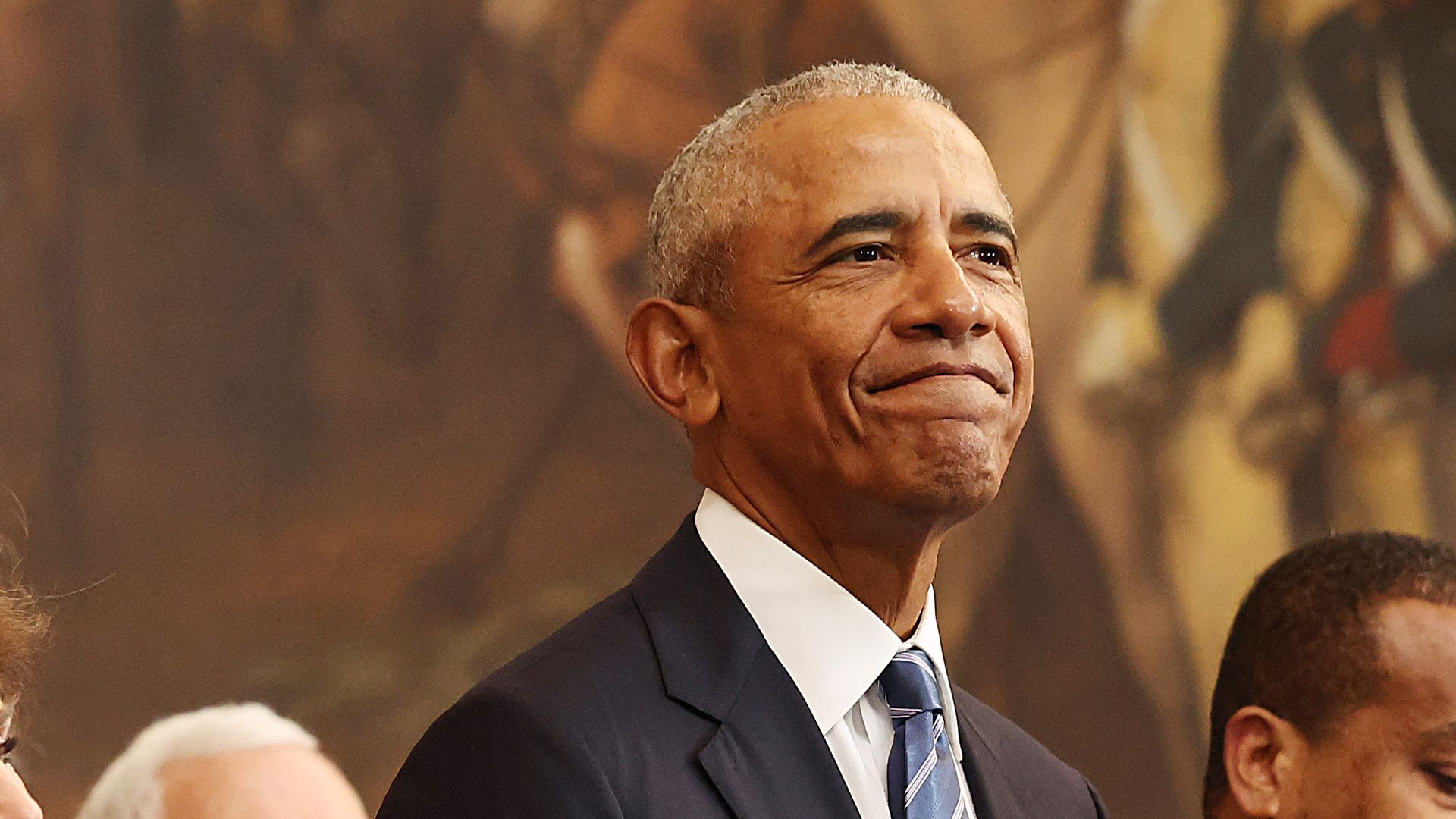 Barack Obama booed as he steps out alone without Michelle Obama at ...