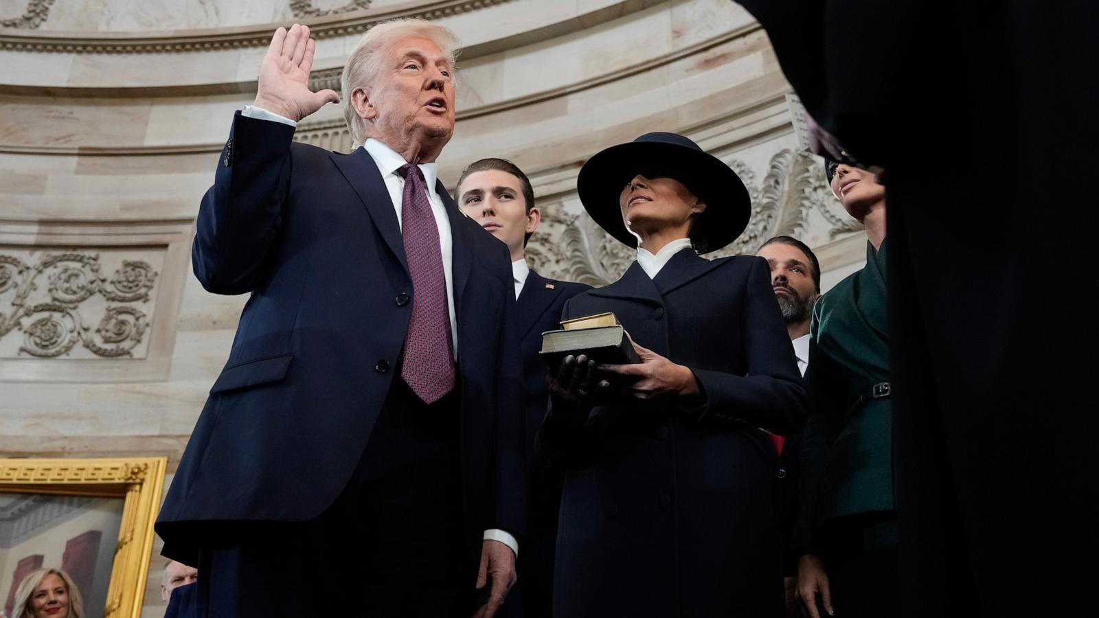 Without putting hand on Bible, Trump takes oath of office Without putting hand on Bible, Trump takes oath of office