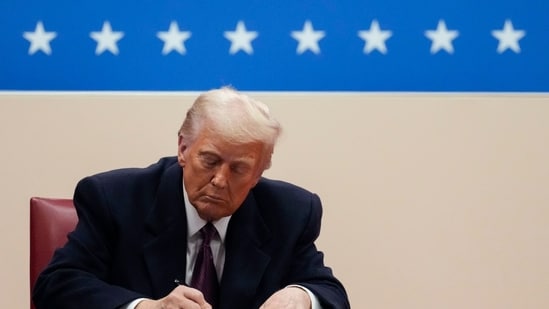 Donald Trump signs first round of executive orders with giant Sharpie ...
