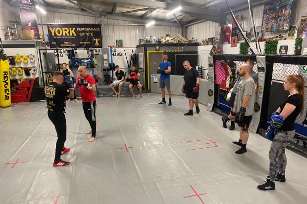 From a 'quiet geeky kid' to world champion fighter - gym owner's bid to win