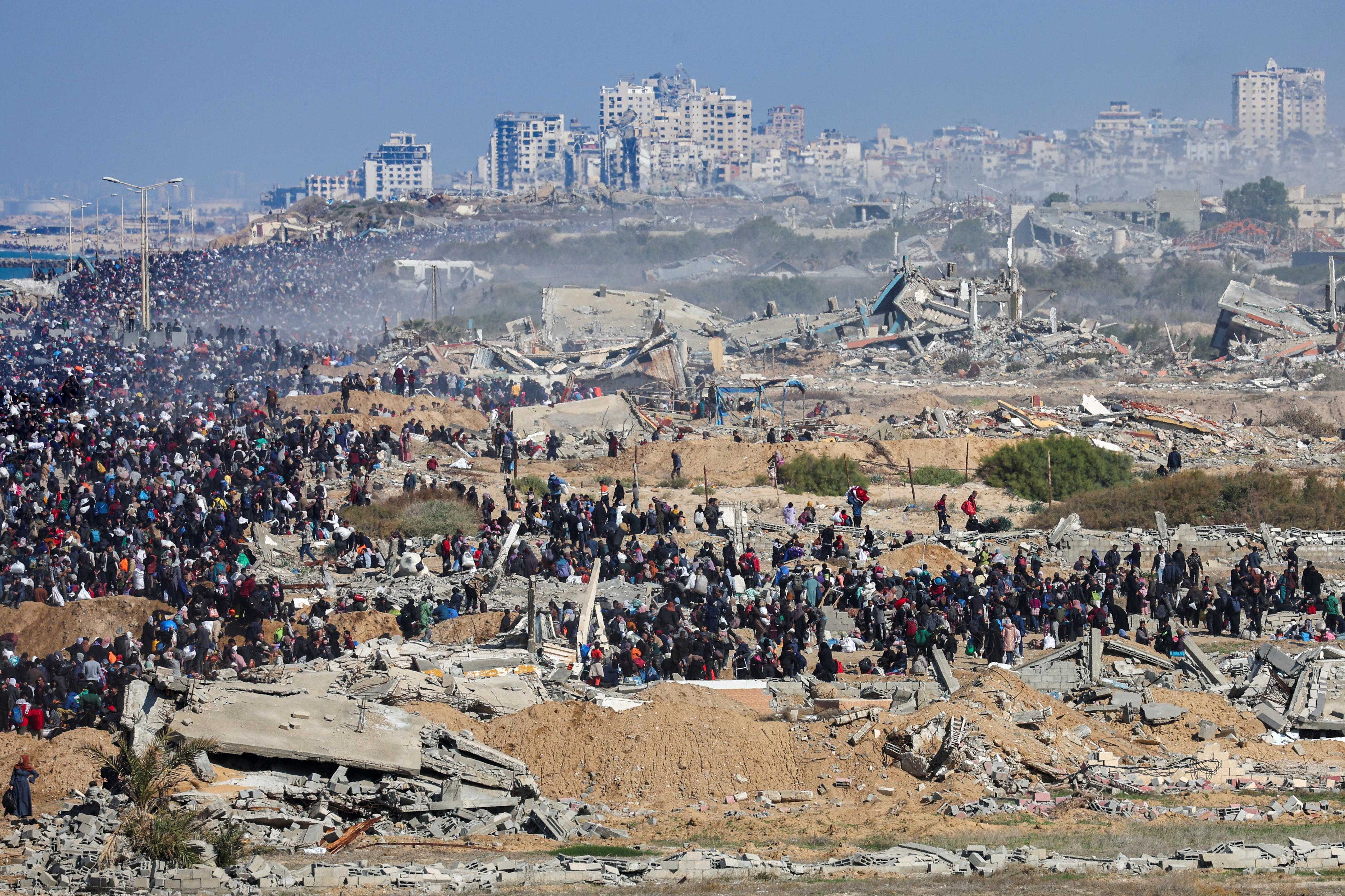 Palestinians make long trek back to their demolished homes in Gaza