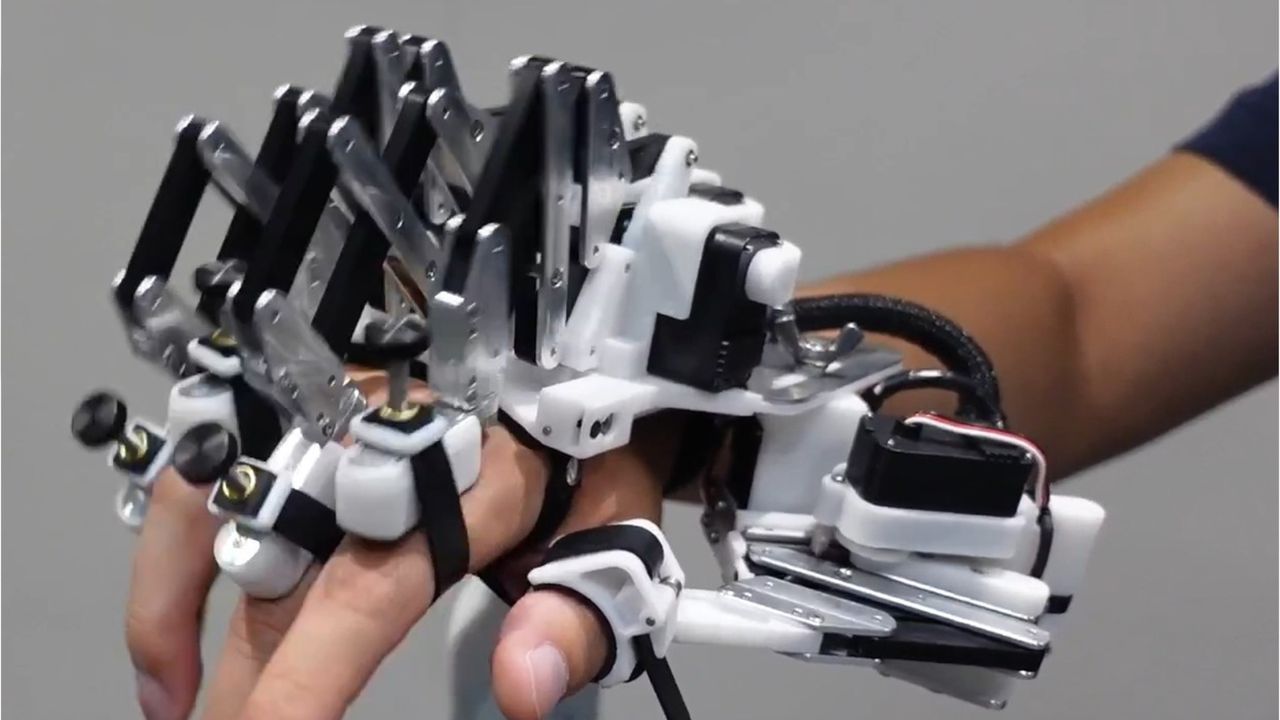 Scientists develop exoskeleton capable of teaching hands to play ...