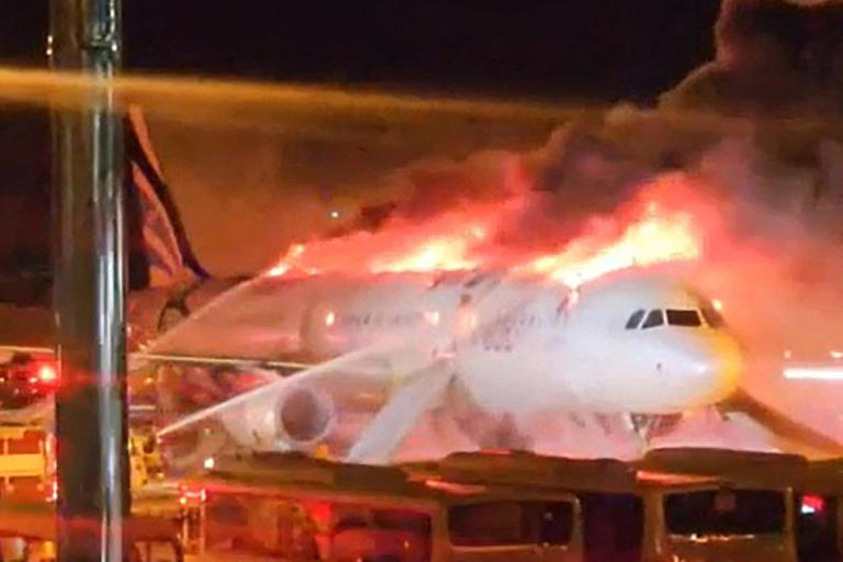 Passenger plane catches fire on runway, leaving at least 7 injured ...