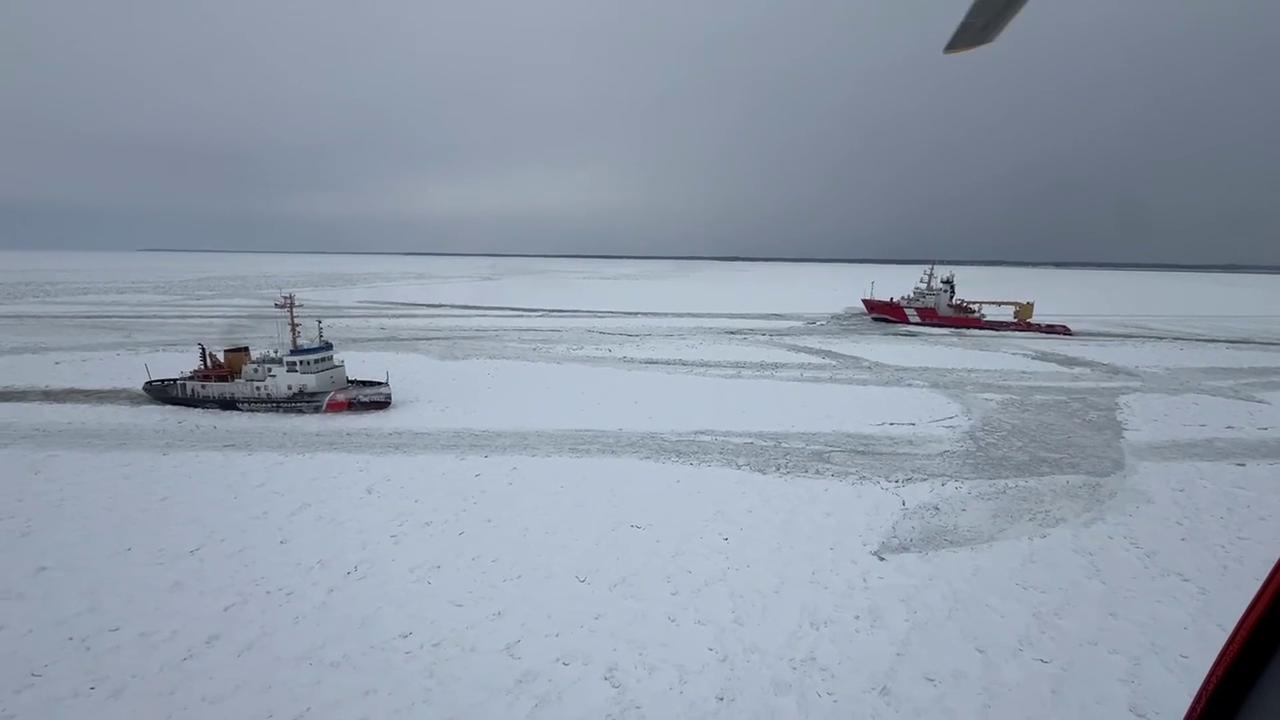 Ice breakers rescue stranded vessel on frozen Lake Erie in New York
