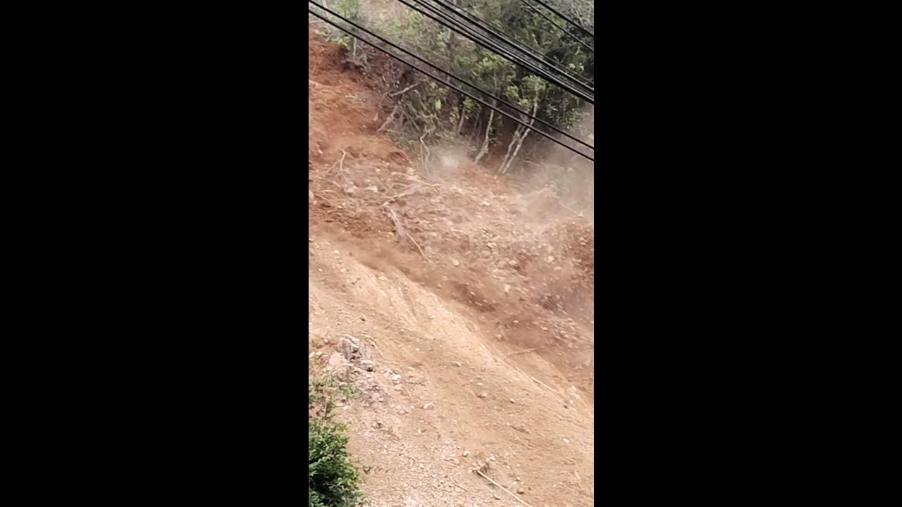 Landslide crashes onto road in front of shocked drivers