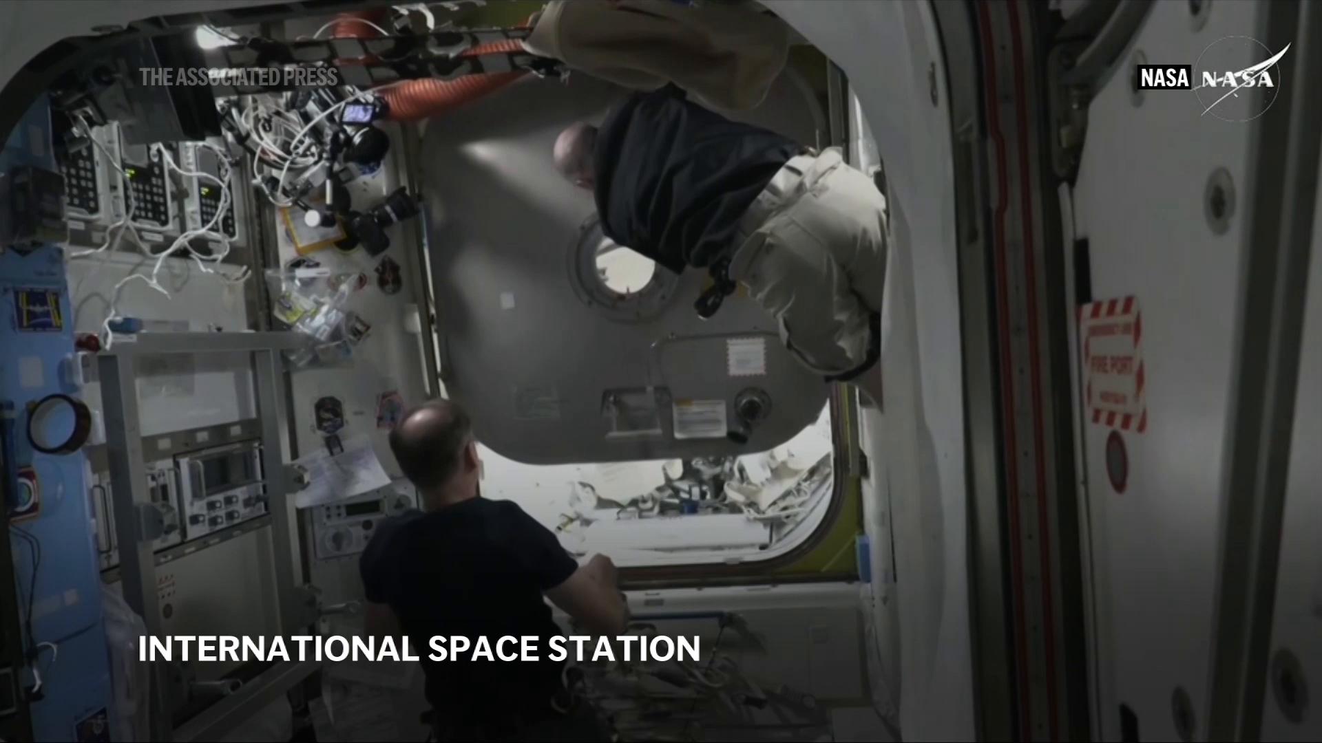 NASA's 2 stuck astronauts take their first spacewalk together